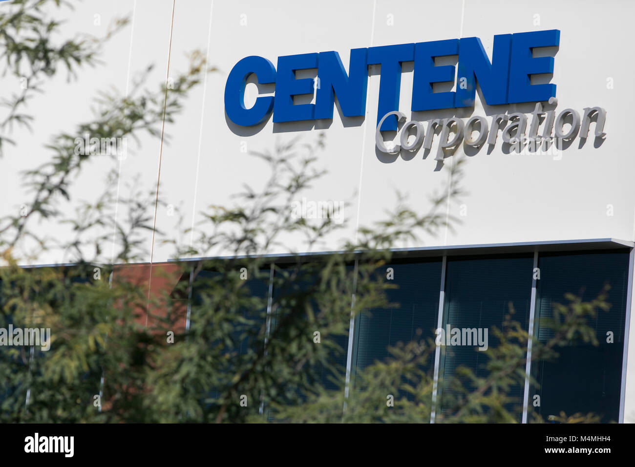 A logo sign outside of a facility occupied by the Centene Corporation ...