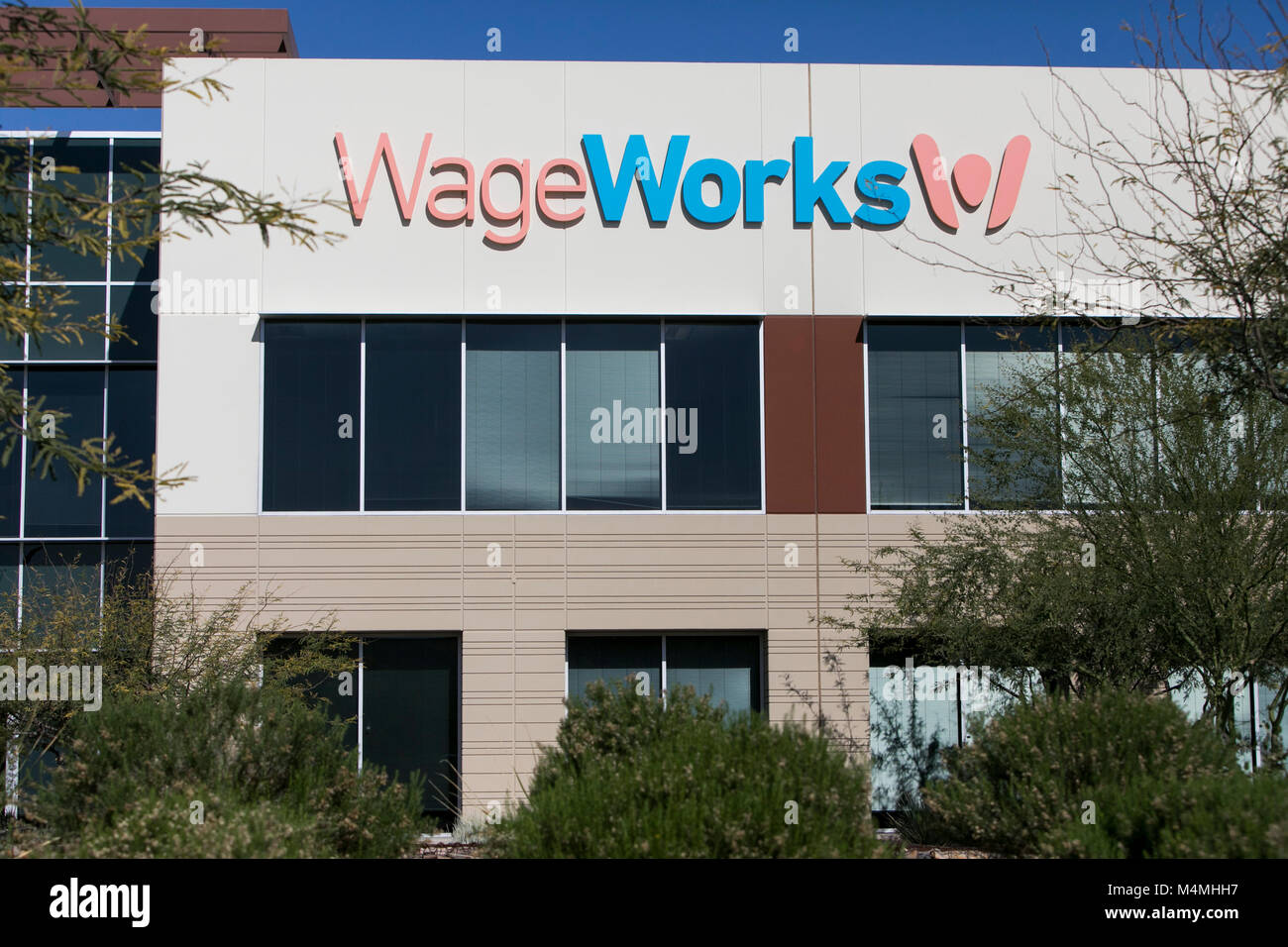 A logo sign outside of a facility occupied by WageWorks in Tempe ...