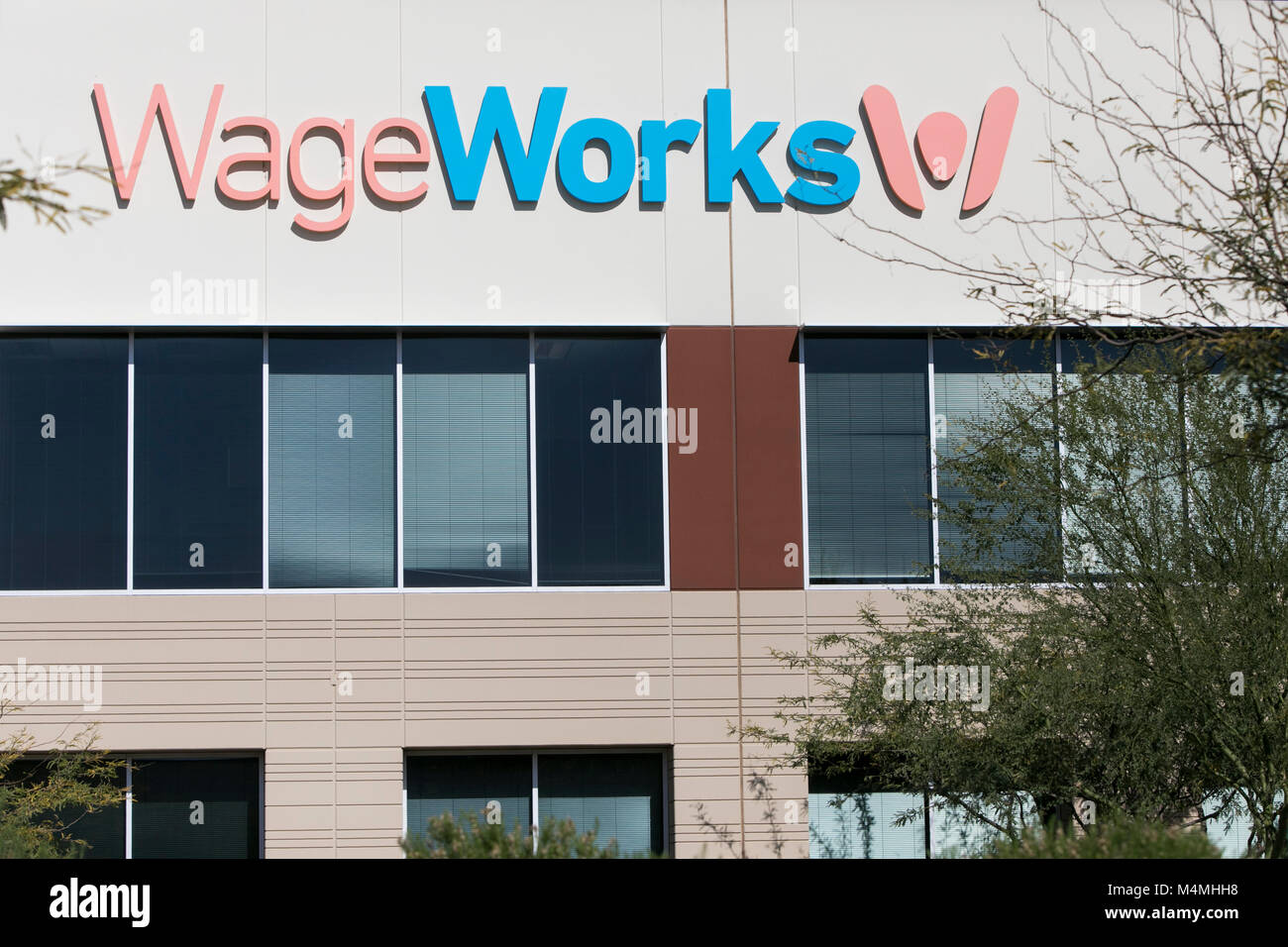 A logo sign outside of a facility occupied by WageWorks in Tempe ...