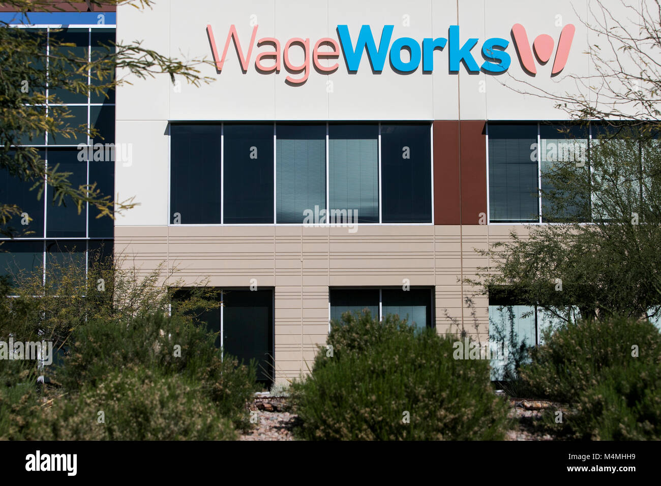 A logo sign outside of a facility occupied by WageWorks in Tempe ...