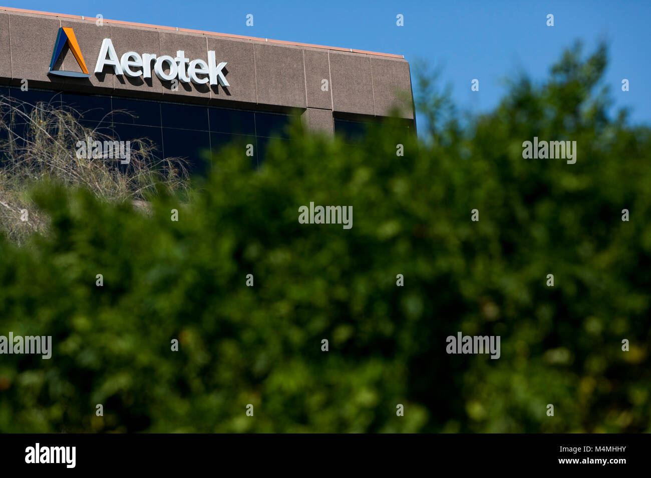 A logo sign outside of a facility occupied by TEKsystems and Aerotek in ...