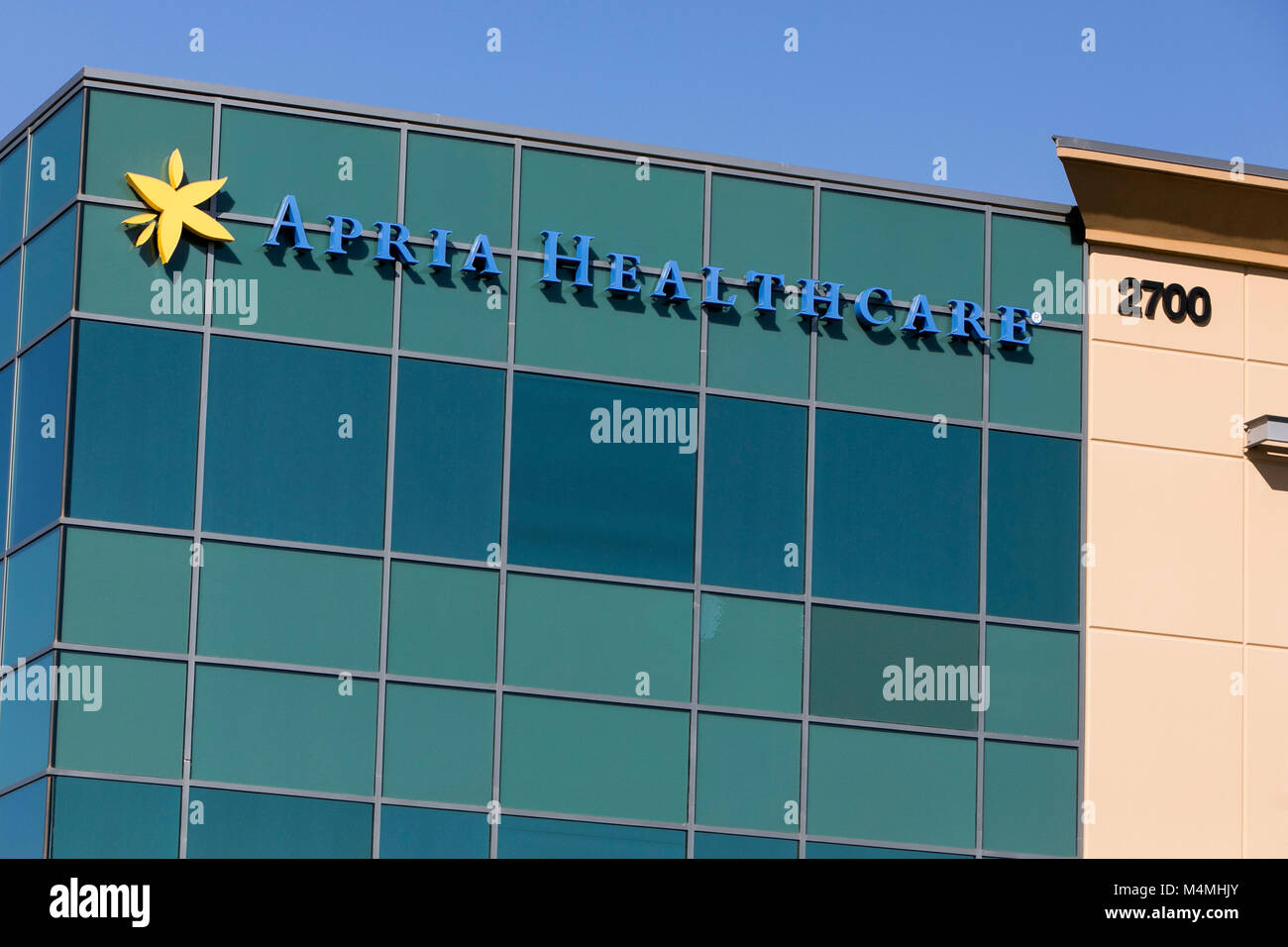 A logo sign outside of a facility occupied by Apria Healthcare Group ...
