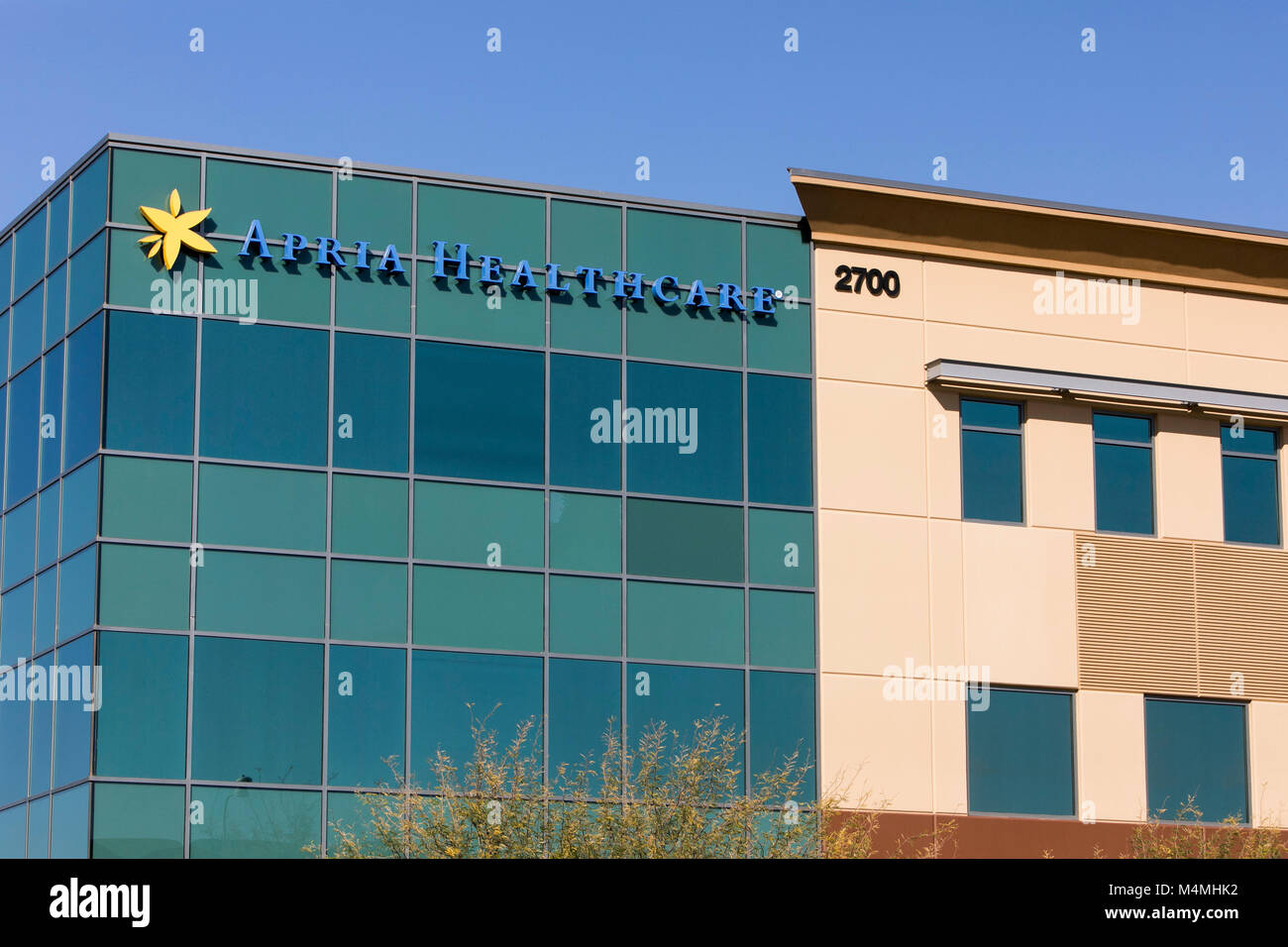 A logo sign outside of a facility occupied by Apria Healthcare Group ...