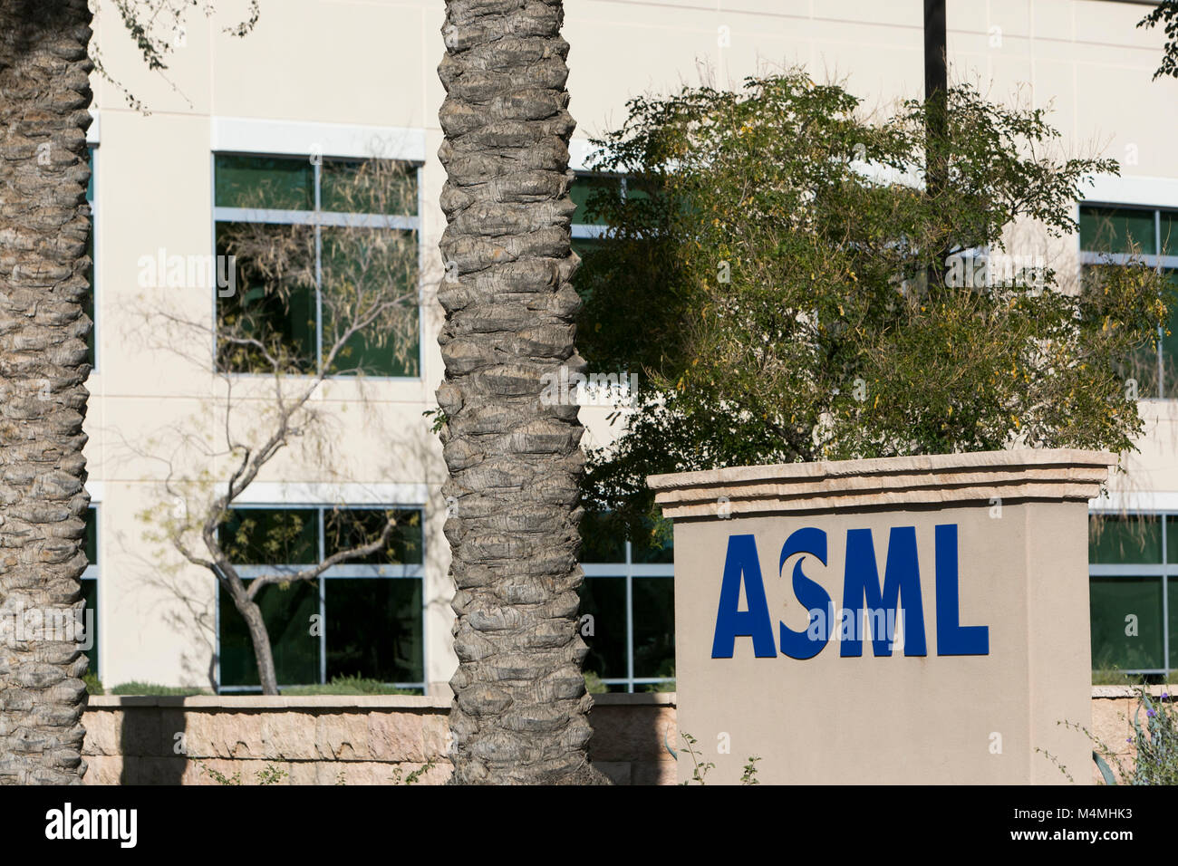 A logo sign outside of a facility occupied by ASML in Chandler, Arizona ...