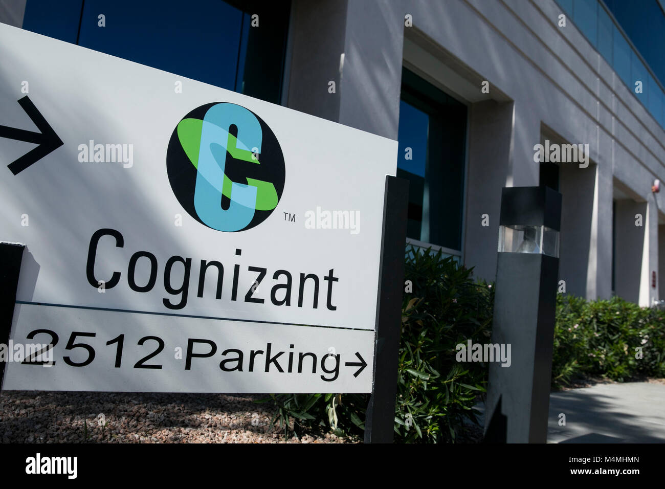 A logo sign outside of a facility occupied by Cognizant in Phoenix ...