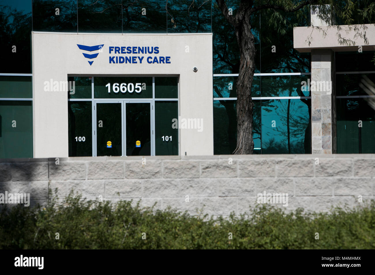 A logo sign outside of a facility occupied by Fresenius Kidney Care in ...