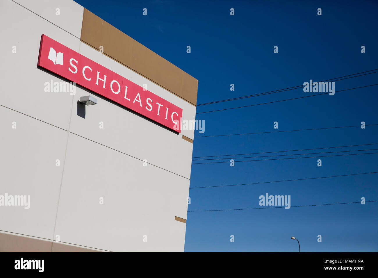 A logo sign outside of a facility occupied by Scholastic in Phoenix ...