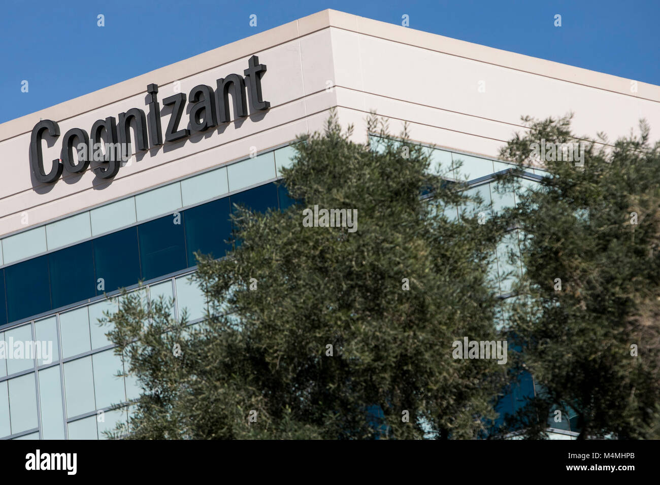 A logo sign outside of a facility occupied by Cognizant in Phoenix ...
