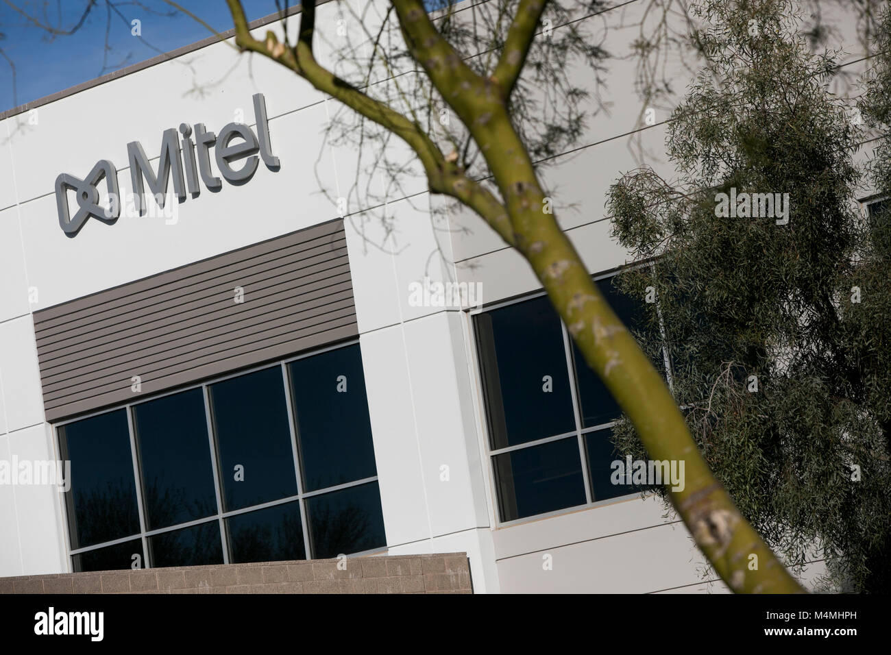 A logo sign outside of a facility occupied by Mitel Networks in Mesa ...