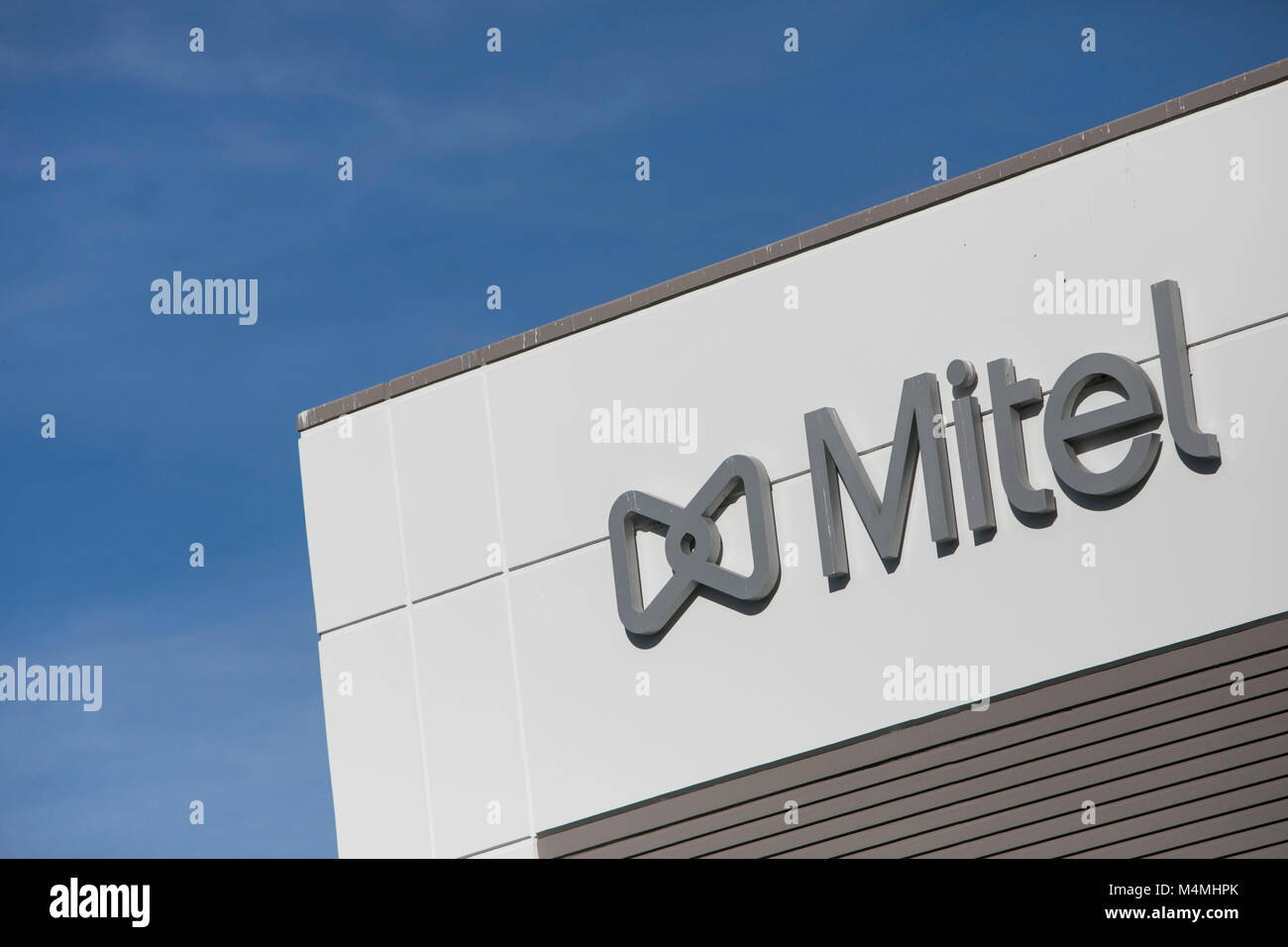 A logo sign outside of a facility occupied by Mitel Networks in Mesa ...