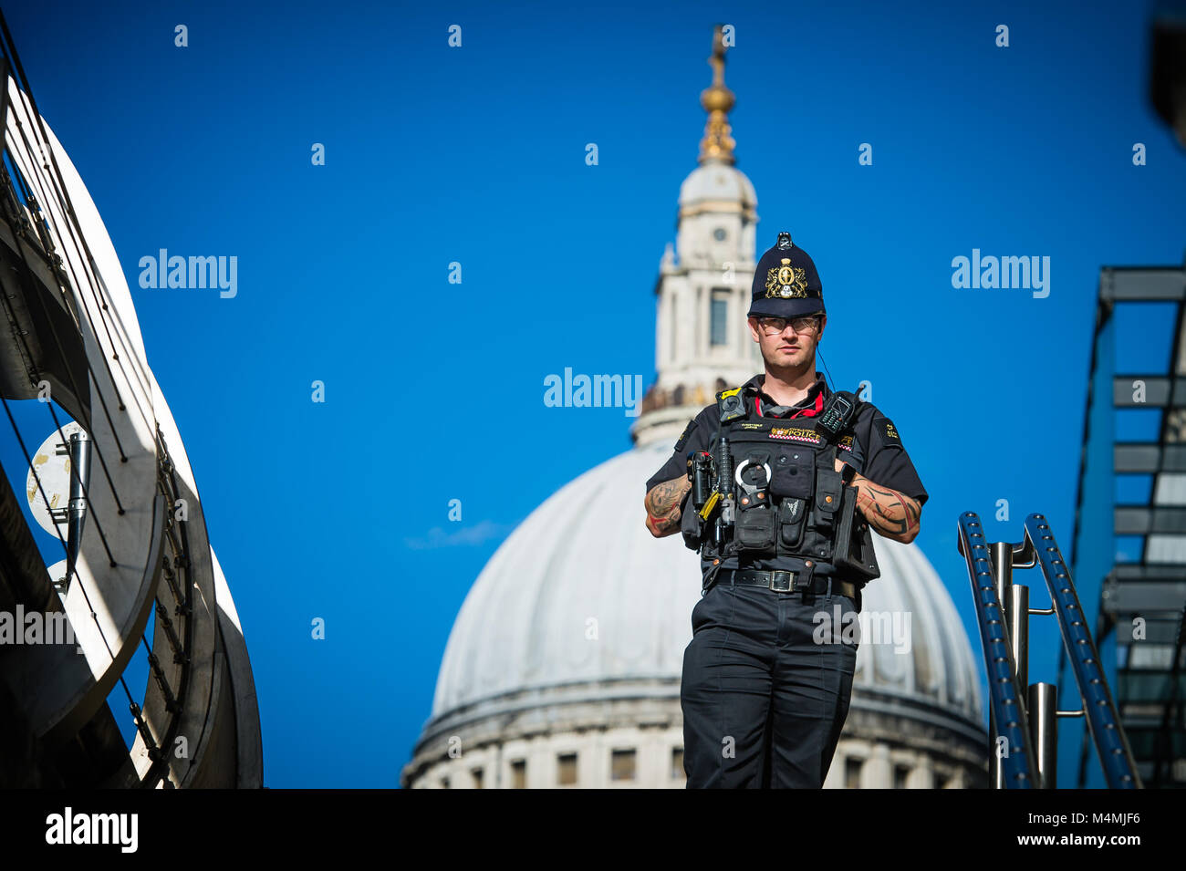 A City of London Police Officer on the Millennium Bridge, London ...