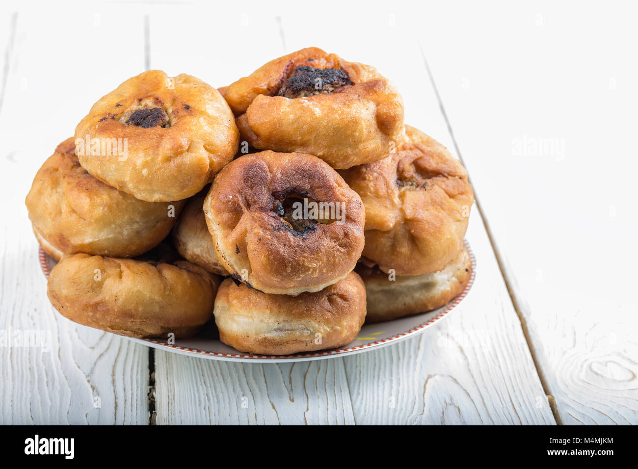 Traditional Russian pie with meat (belyash). Copy space Stock Photo - Alamy