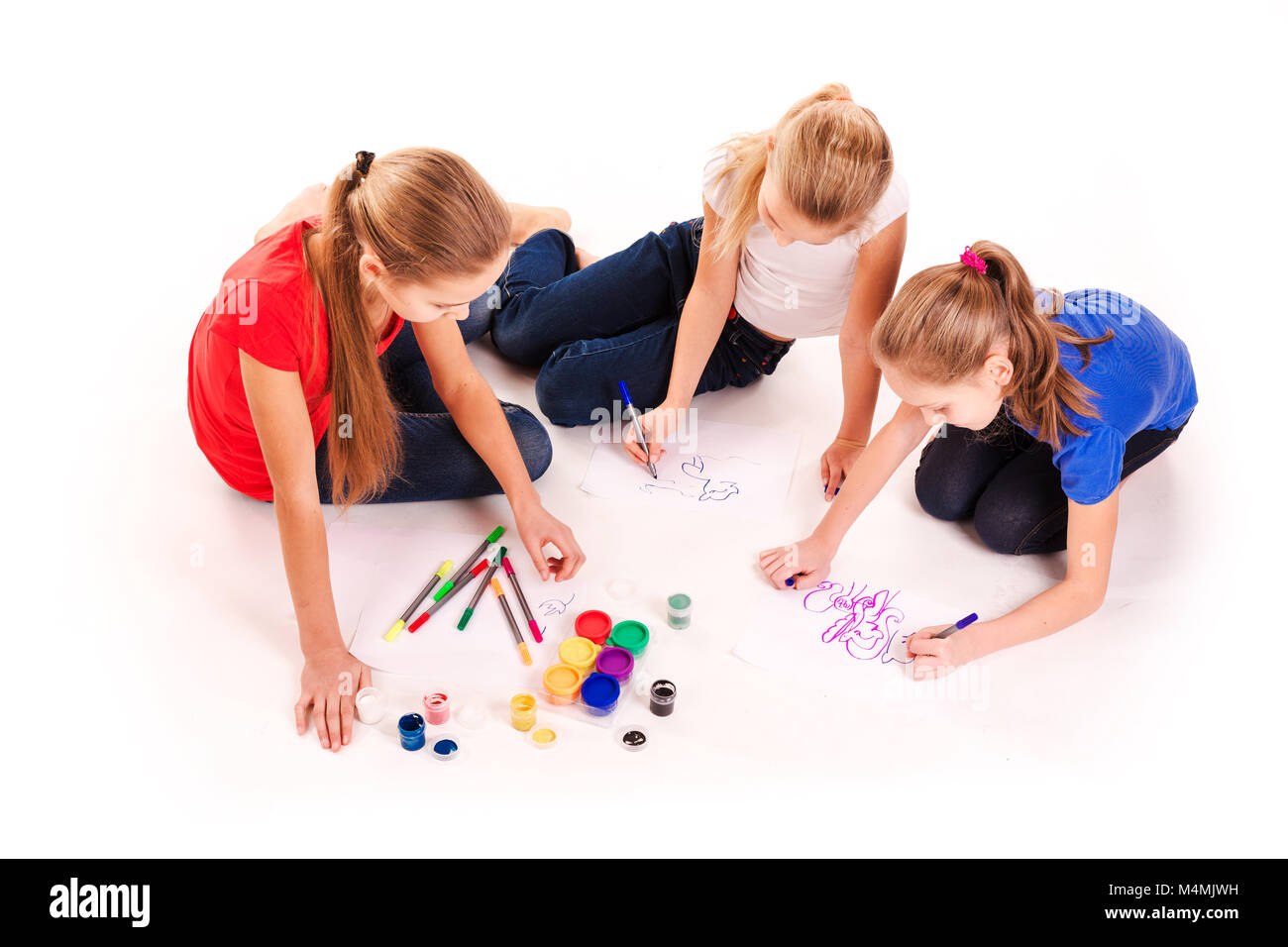Happy kids drawing isolated on white. Team work, creativity concept ...