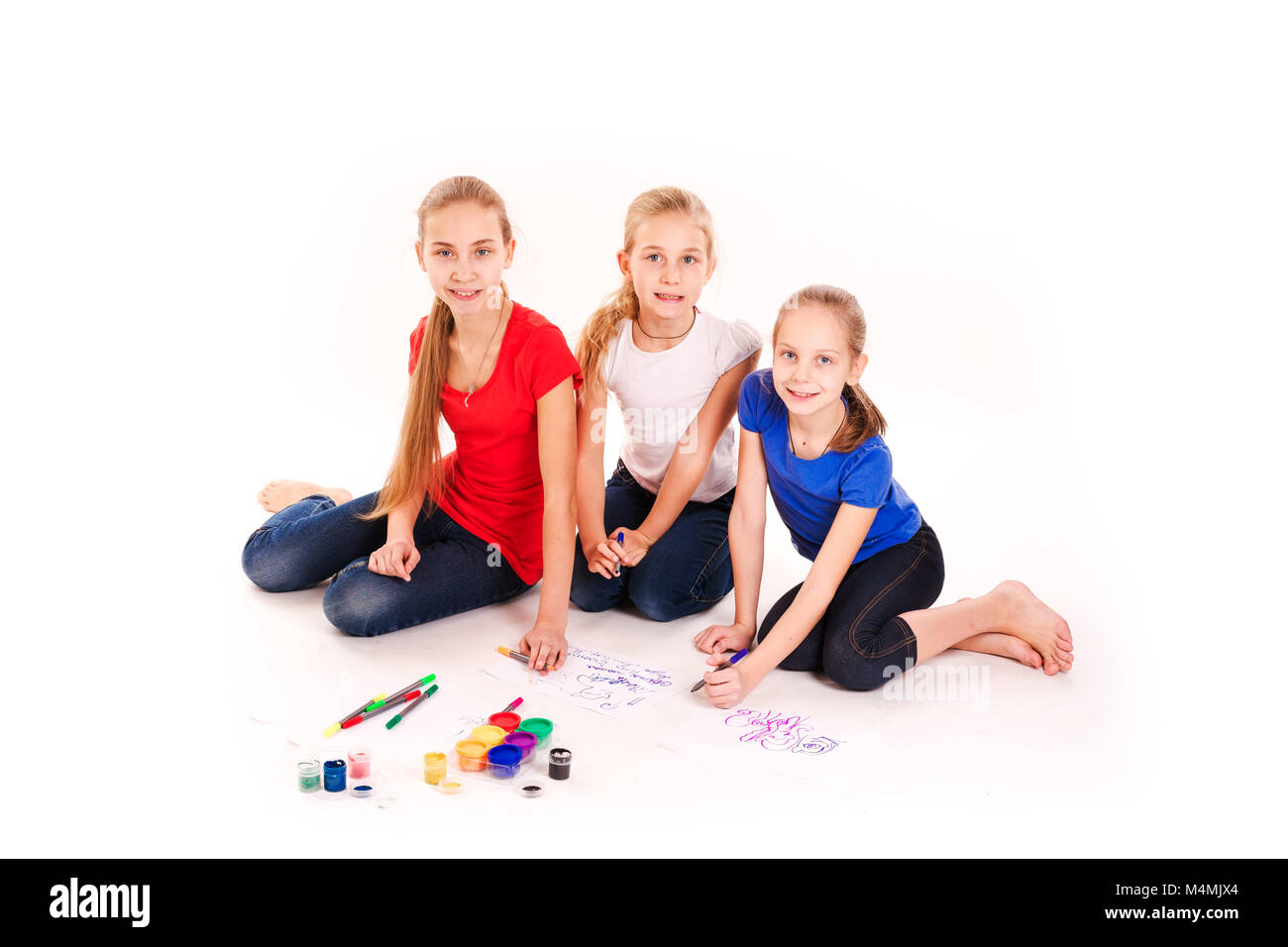 Happy kids drawing isolated on white. Team work, creativity concept ...