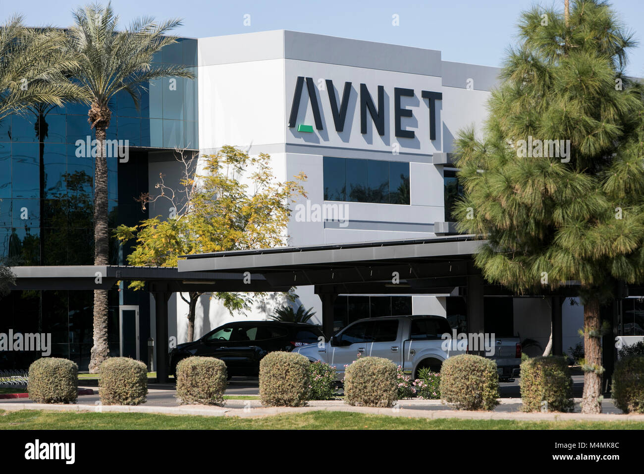 A logo sign outside of the headquarters of Avnet, Inc., in Phoenix ...