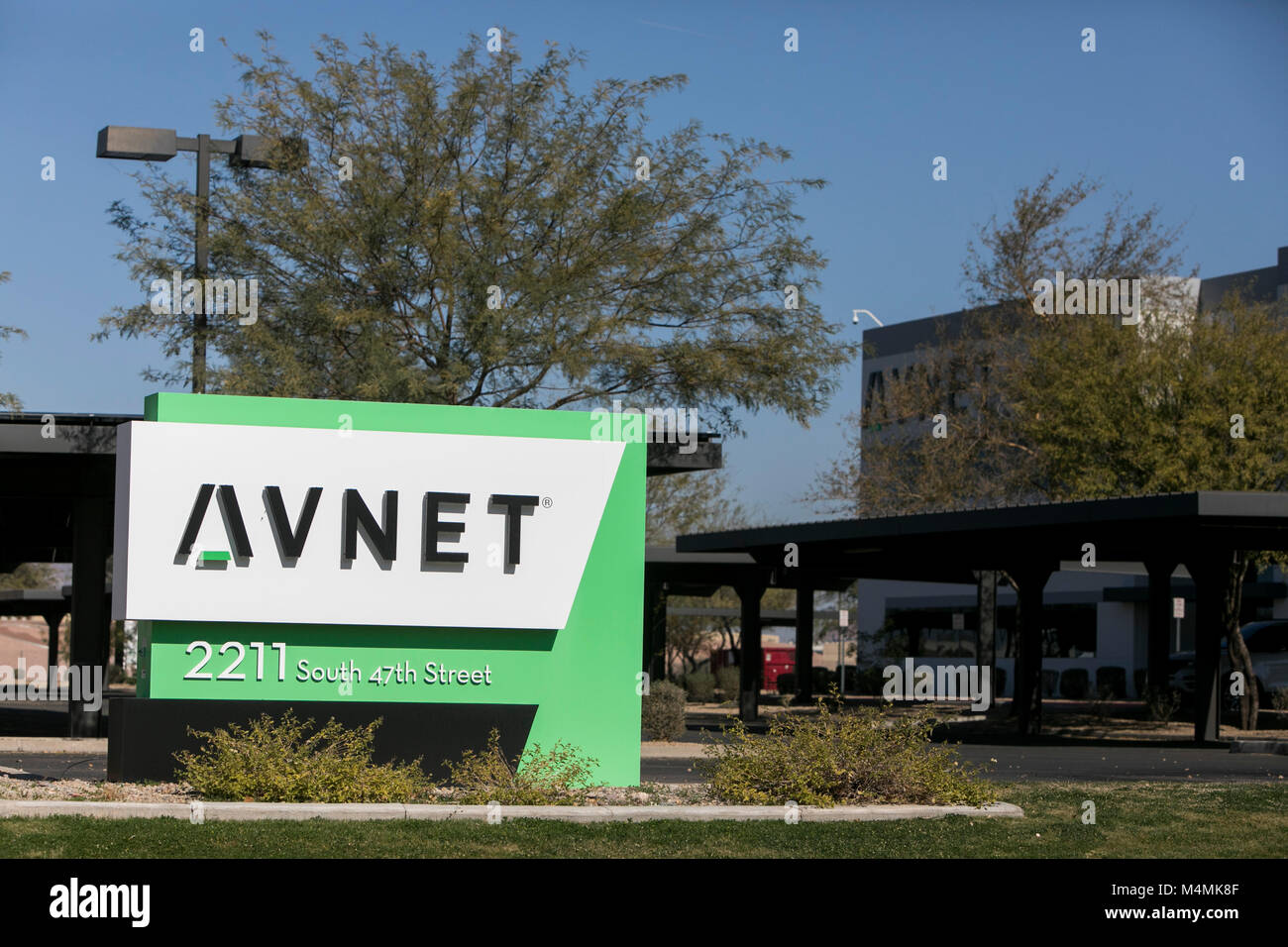 A logo sign outside of the headquarters of Avnet, Inc., in Phoenix ...