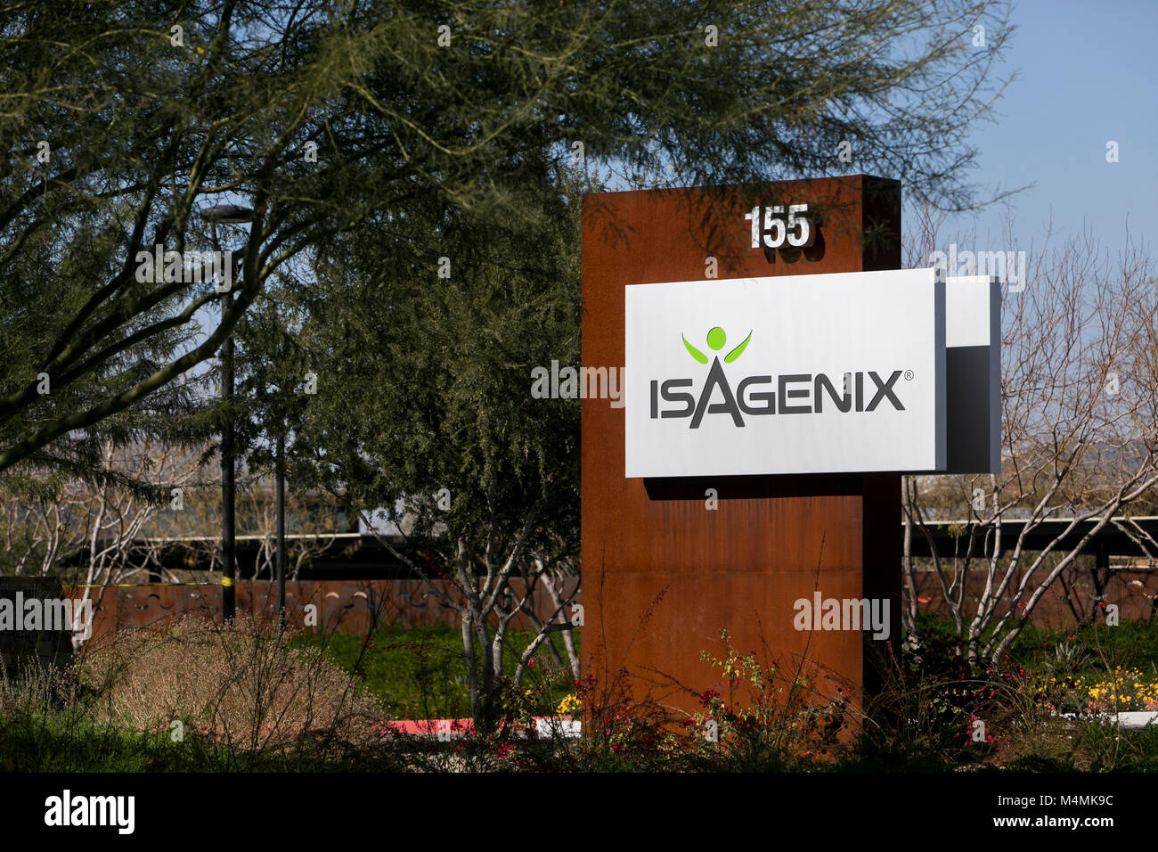 A logo sign outside of the headquarters of Isagenix International in ...