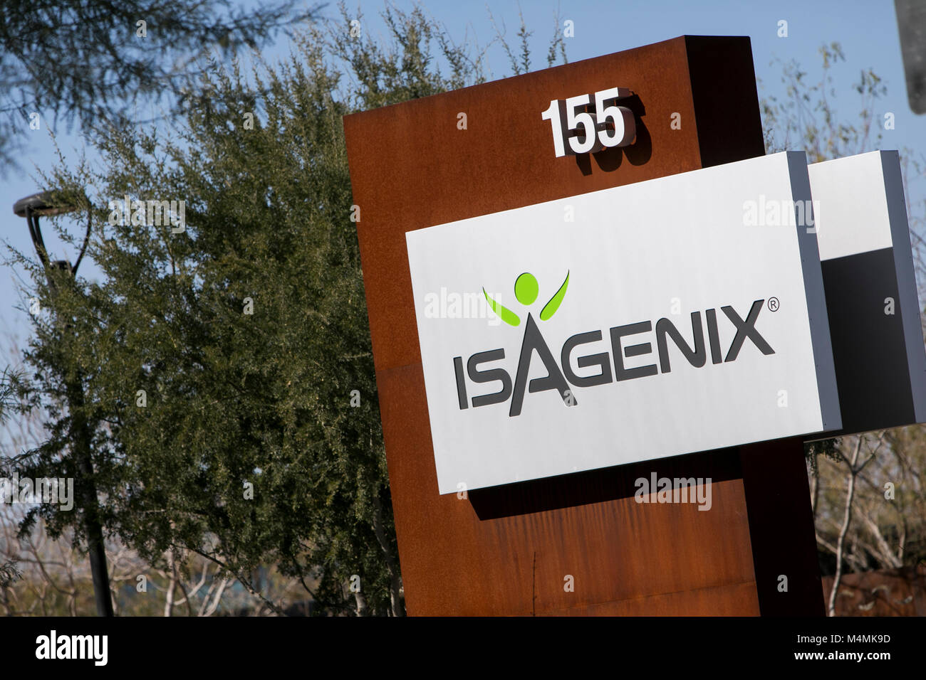 A logo sign outside of the headquarters of Isagenix International in ...