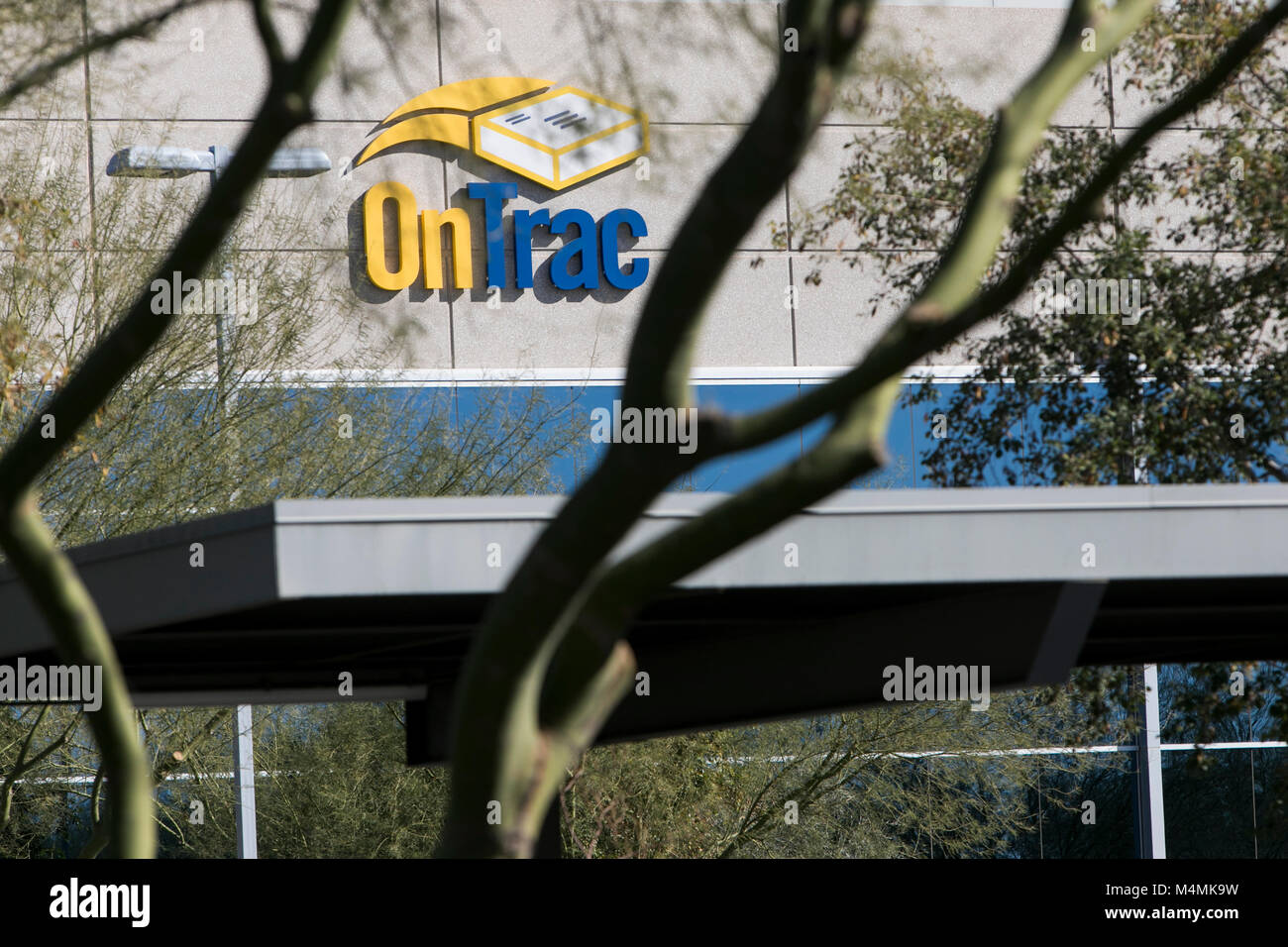 A logo sign outside of the headquarters of OnTrac in Chandler, Arizona ...