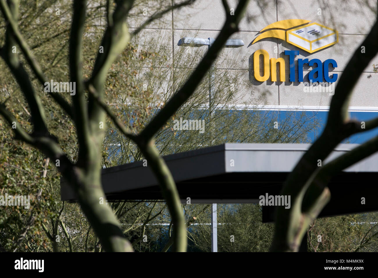 A logo sign outside of the headquarters of OnTrac in Chandler, Arizona ...
