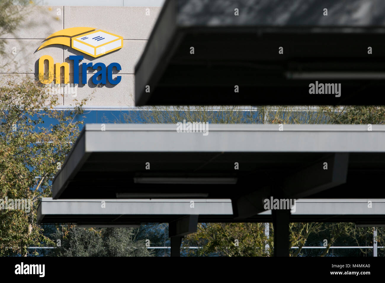 A logo sign outside of the headquarters of OnTrac in Chandler, Arizona ...