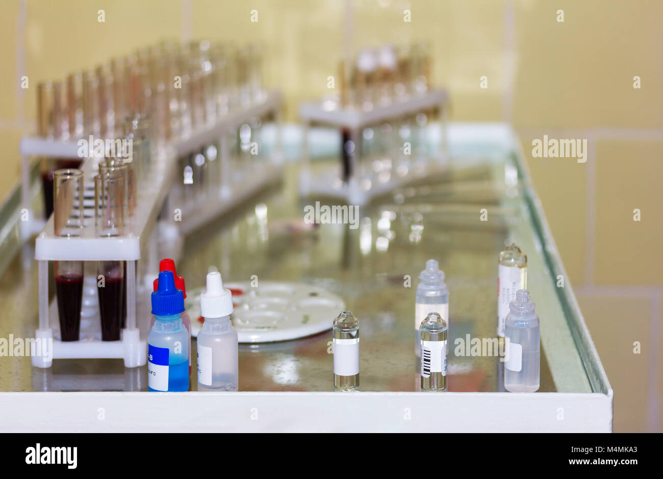 test tubes with blood and ampoules with solution for injection on the ...