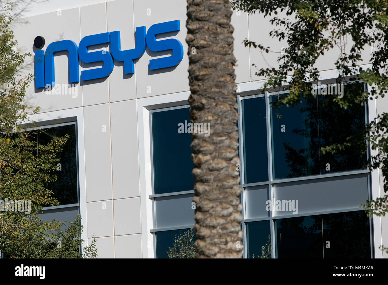 A logo sign outside of the headquarters of Insys Therapeutics in ...