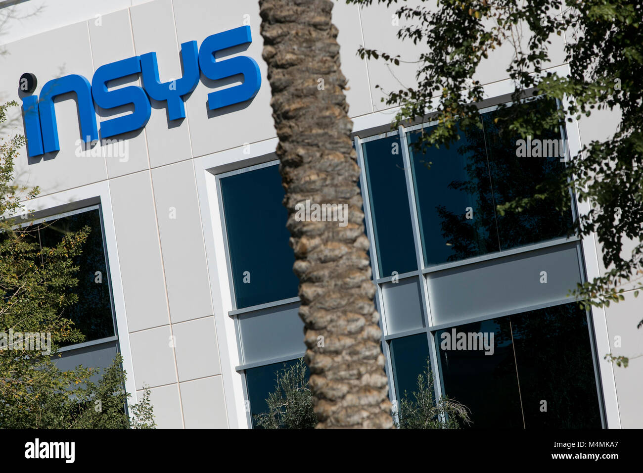 A logo sign outside of the headquarters of Insys Therapeutics in ...