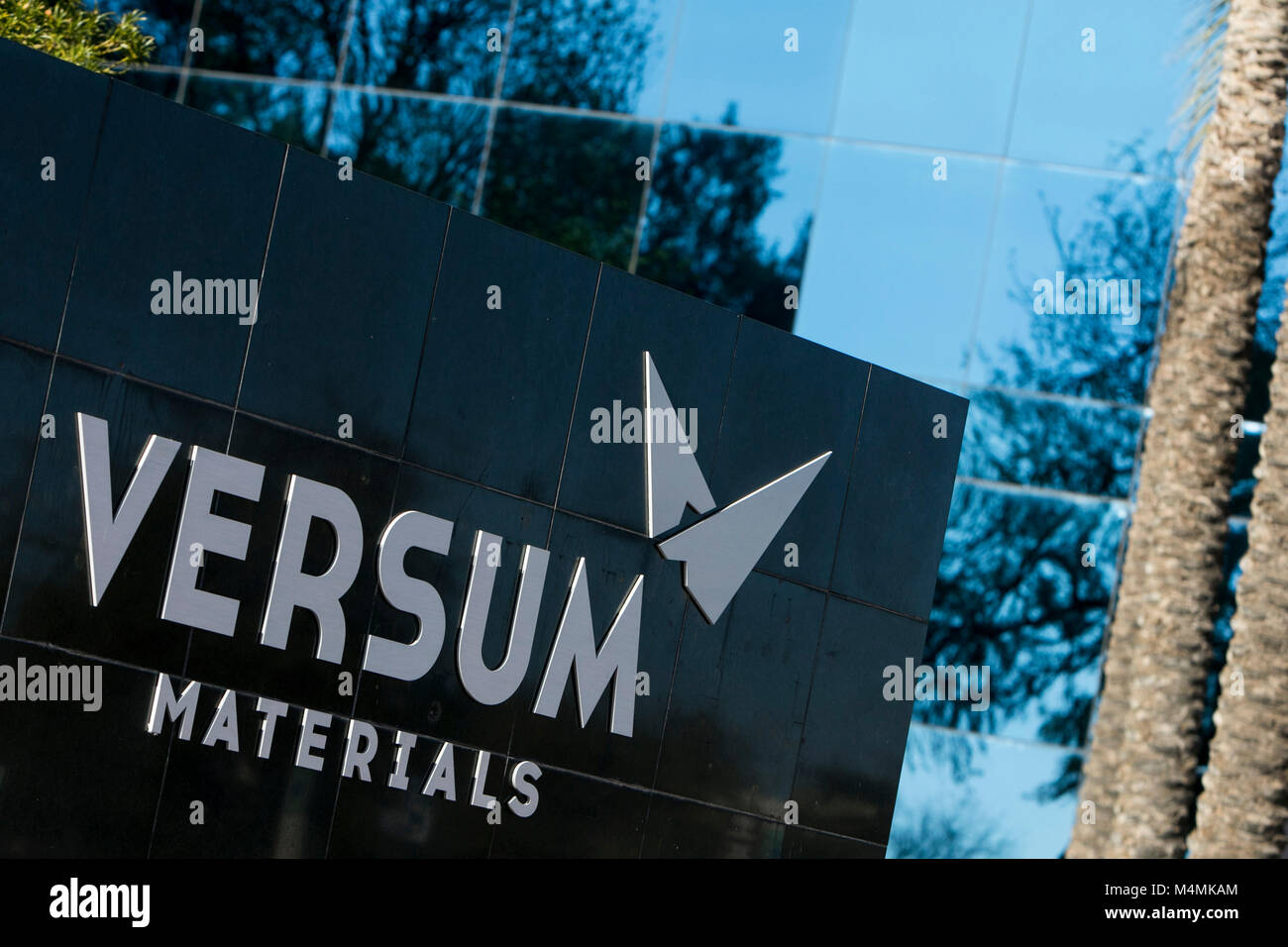 A logo sign outside of a the headquarters of Versum Materials in Tempe ...