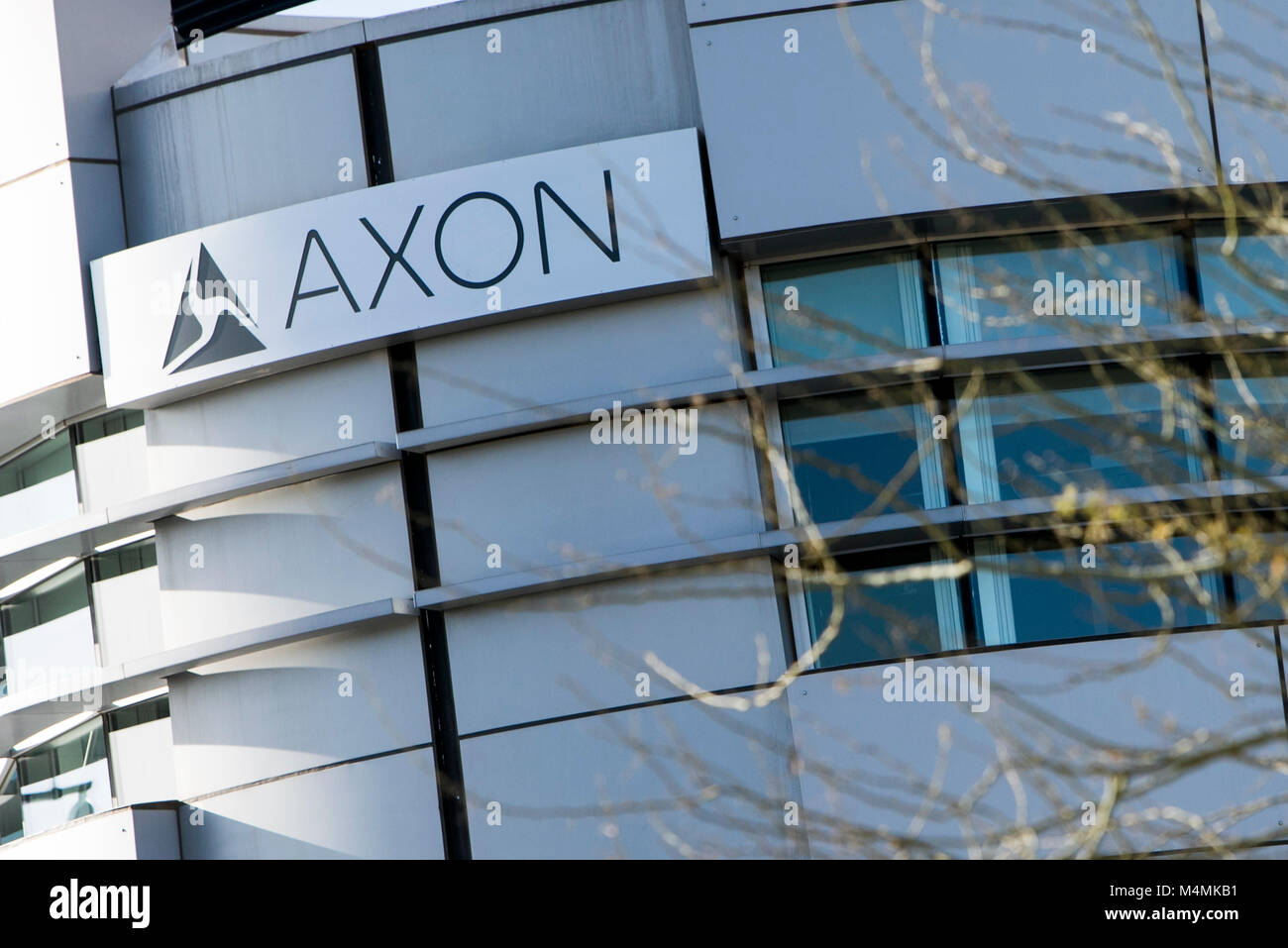A logo sign outside of the headquarters of Axon in Scottsdale, Arizona ...