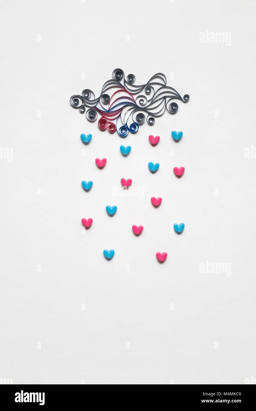 Creative valentines concept photo of cloud with hearts raining down on ...
