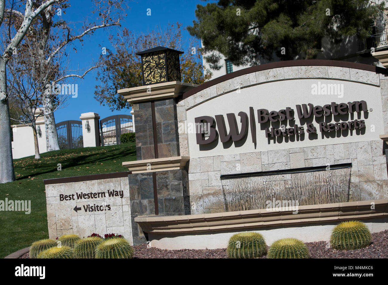 A logo sign outside of the headquarters of Best Western International ...