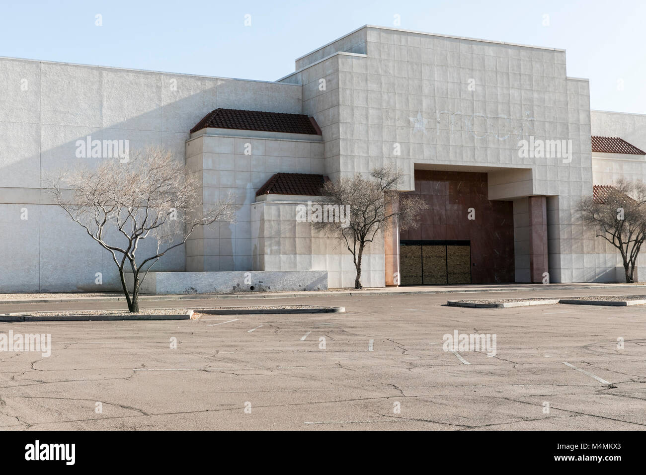 The faded outline of a logo sign outside of a now closed Macy's retail ...