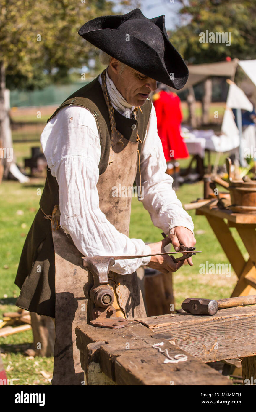 British blacksmith working during a reenactment of the American ...