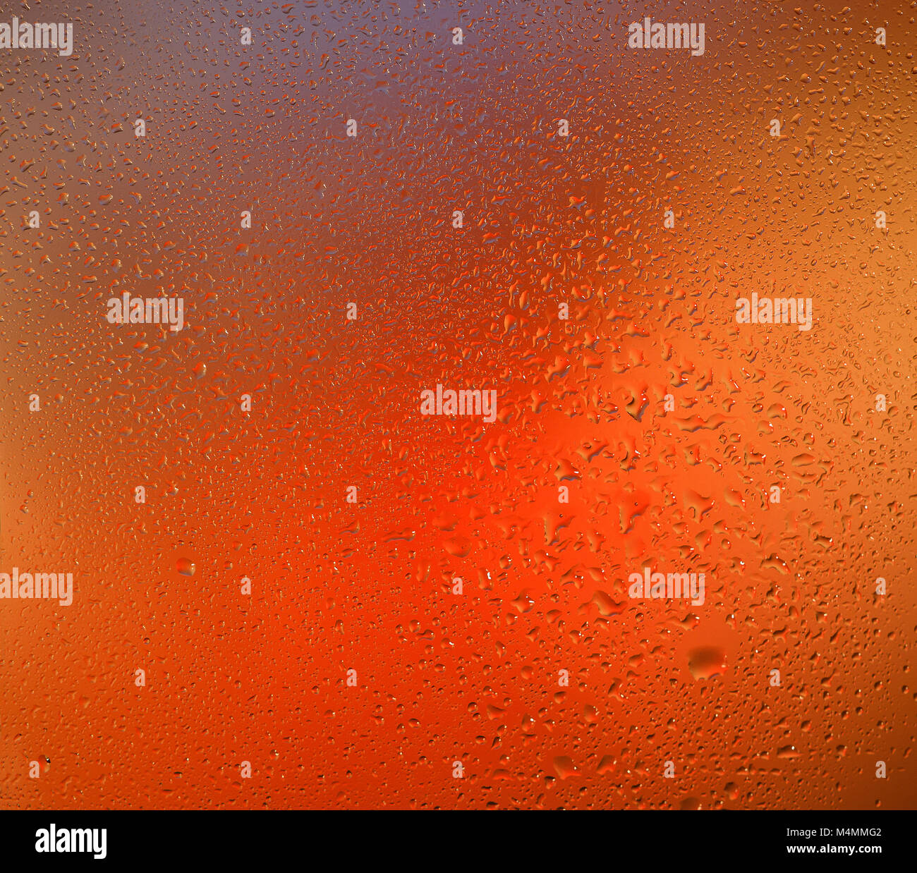 Natural water drops on glass red colors Stock Photo - Alamy