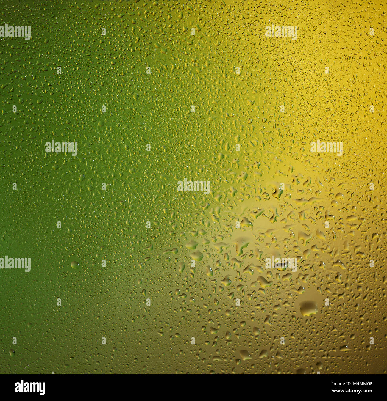 Natural water drops on glass green colors Stock Photo - Alamy