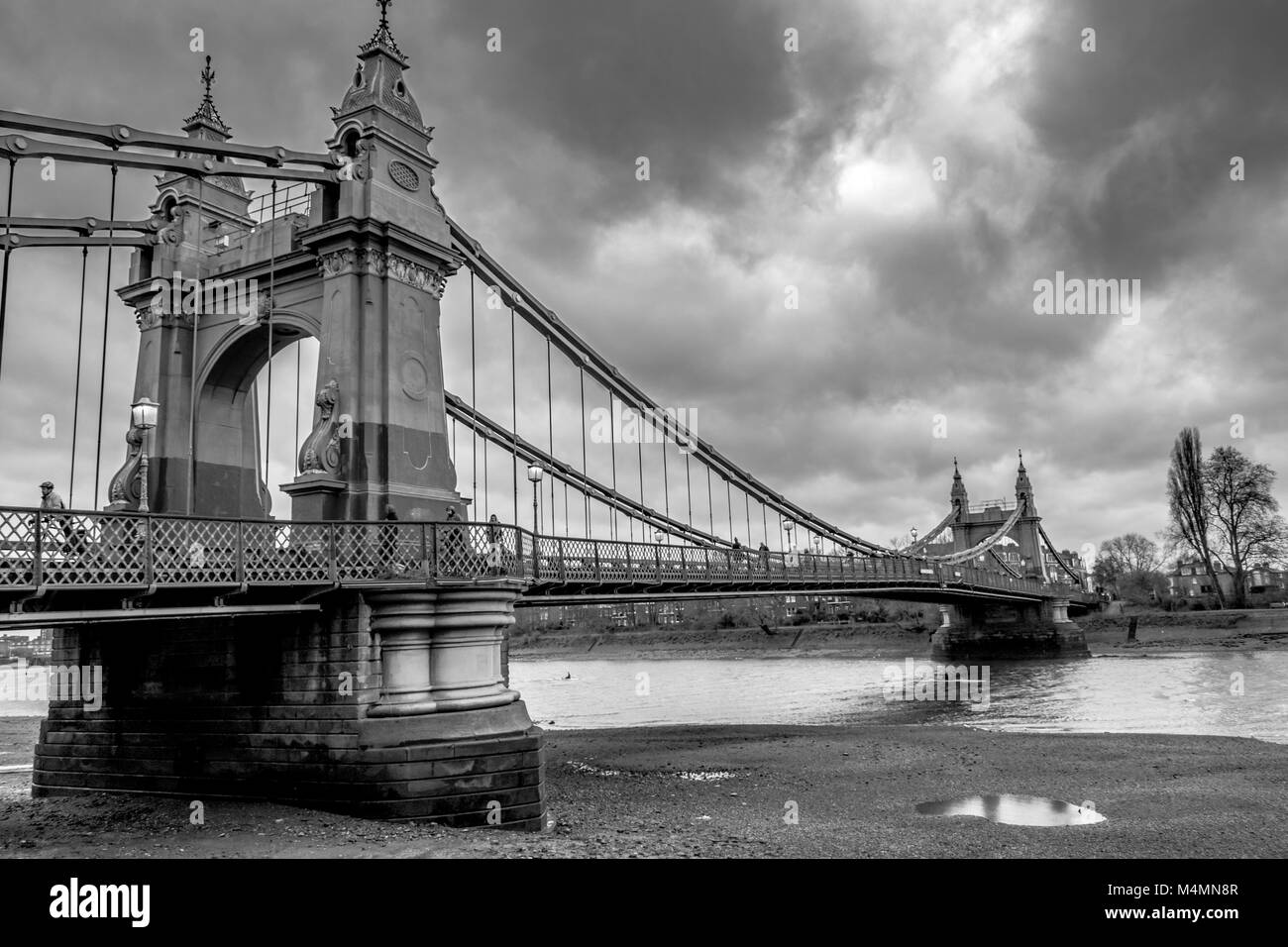 A black and white photograph of Hammersmith suspension bridge in London ...