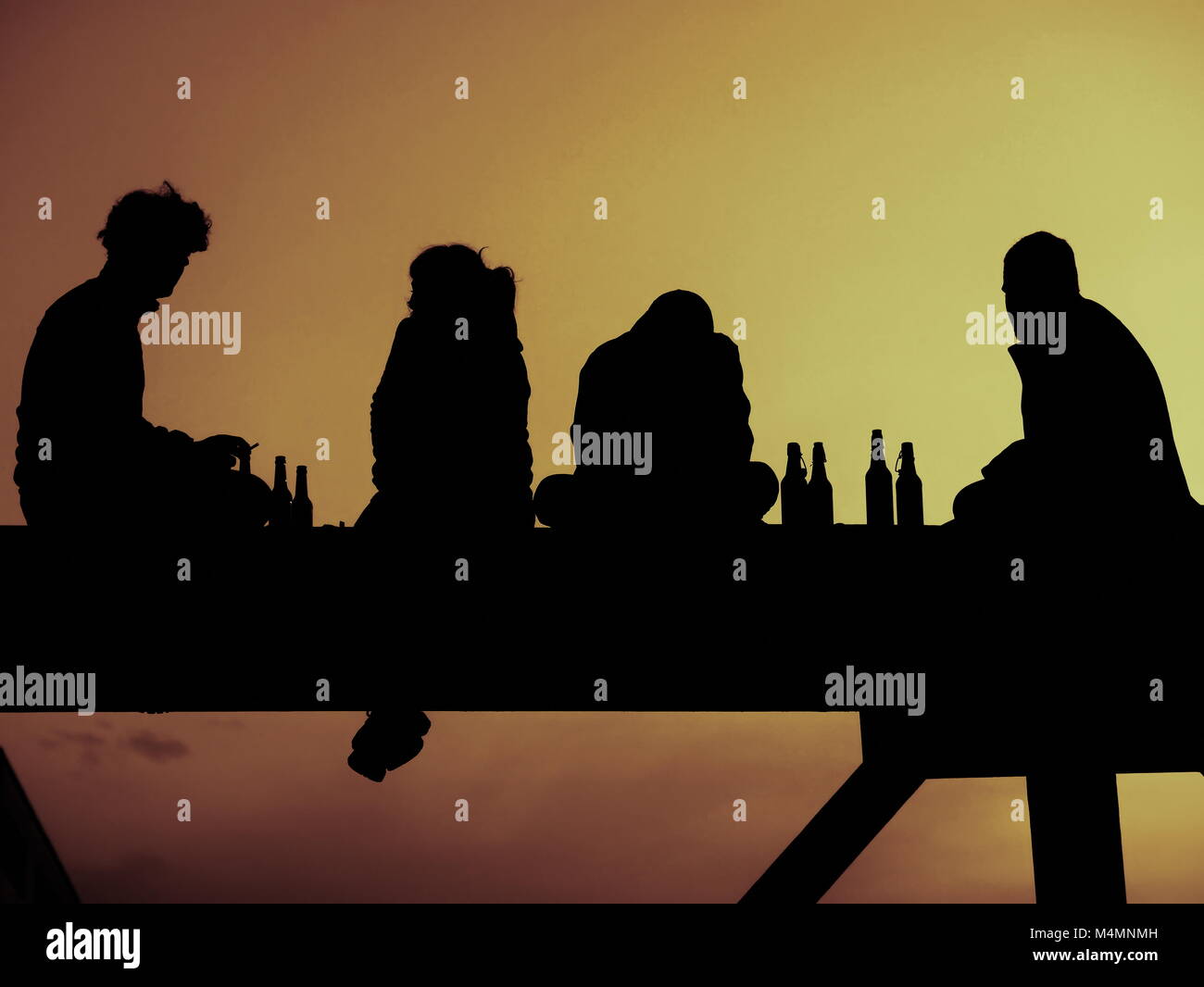 Silhouette of four friend Stock Photo - Alamy