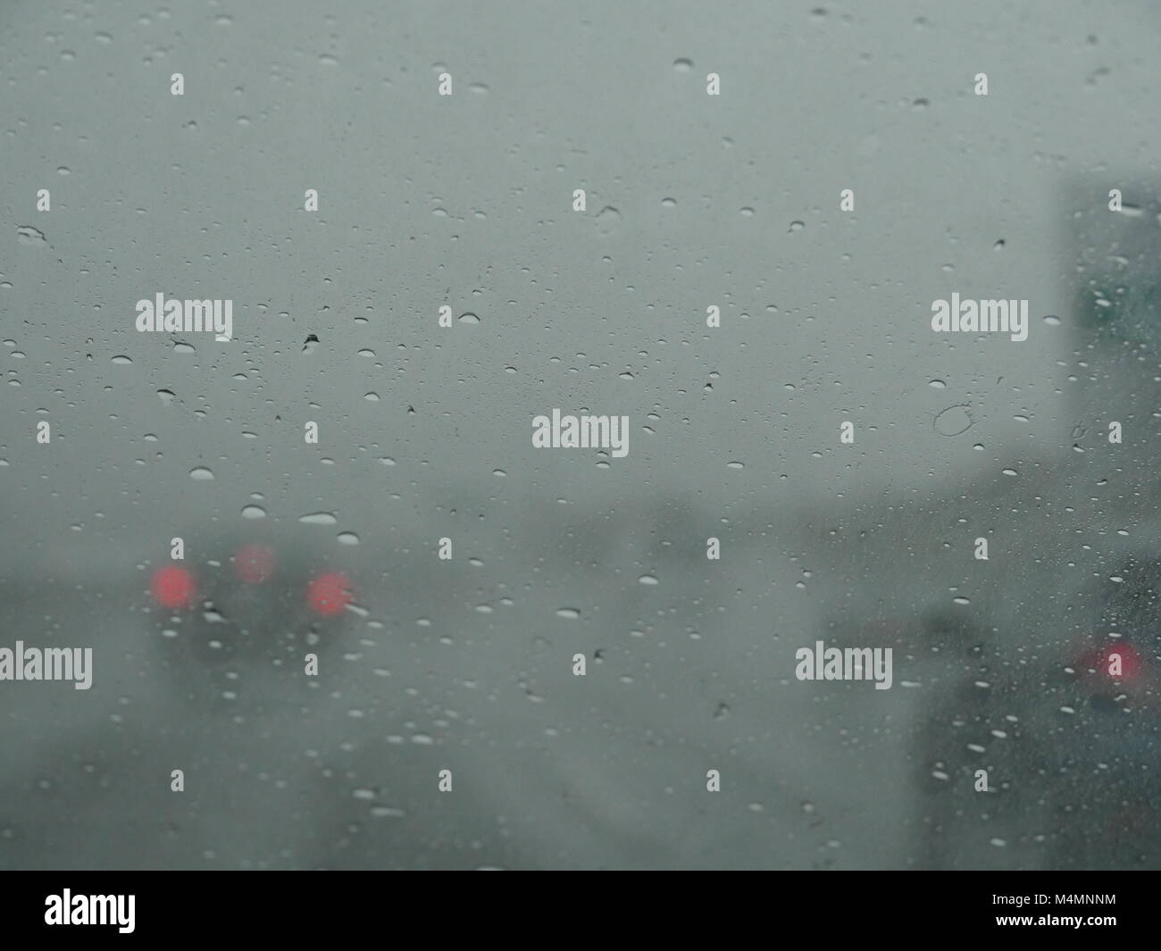 View on highway through wet window Stock Photo - Alamy
