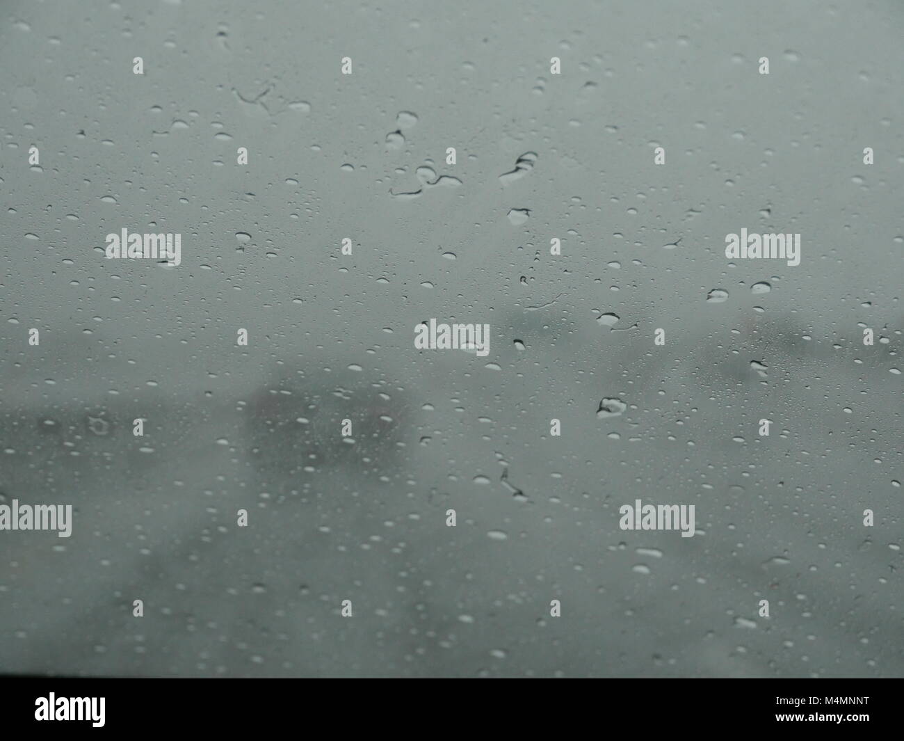 View on highway through wet window Stock Photo - Alamy