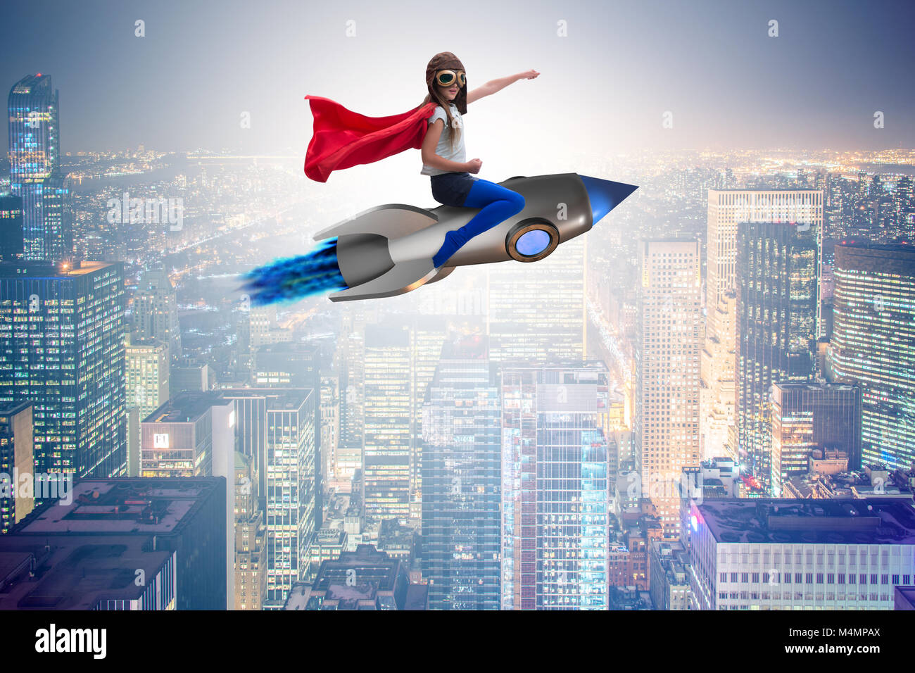 Little girl flying rocket in superhero concept Stock Photo - Alamy
