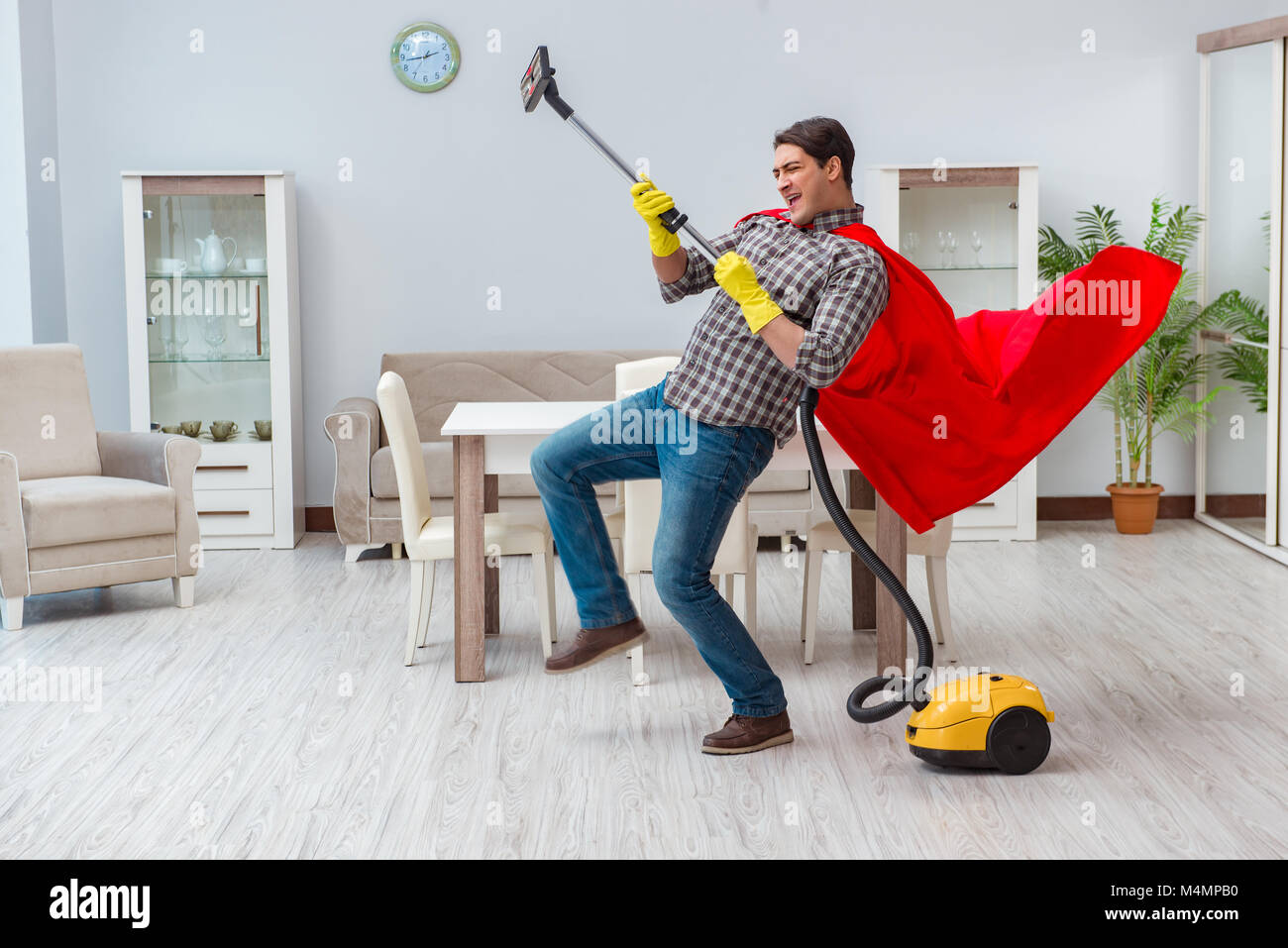 Super hero cleaner working at home Stock Photo - Alamy