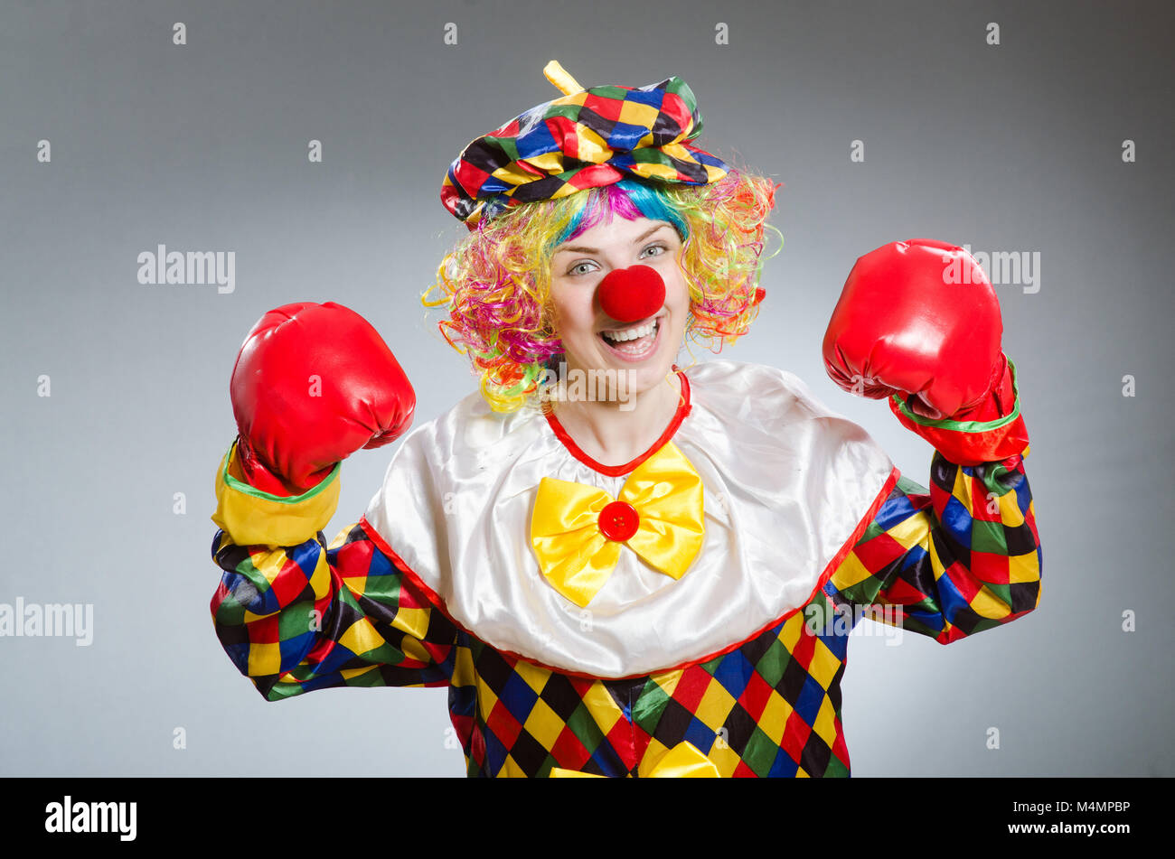 Funny clown in comical concept Stock Photo - Alamy