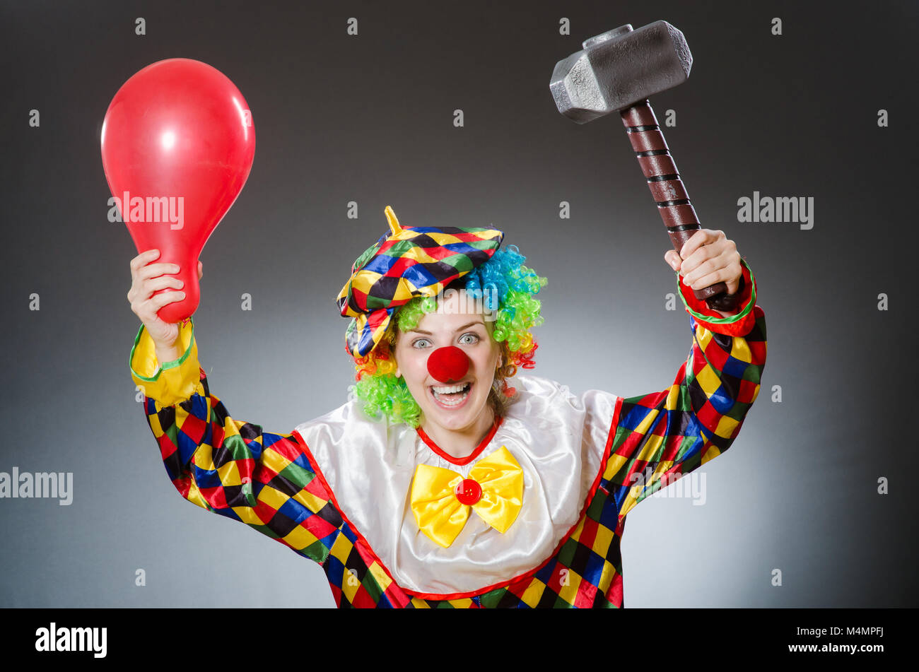 Funny clown in comical concept Stock Photo - Alamy