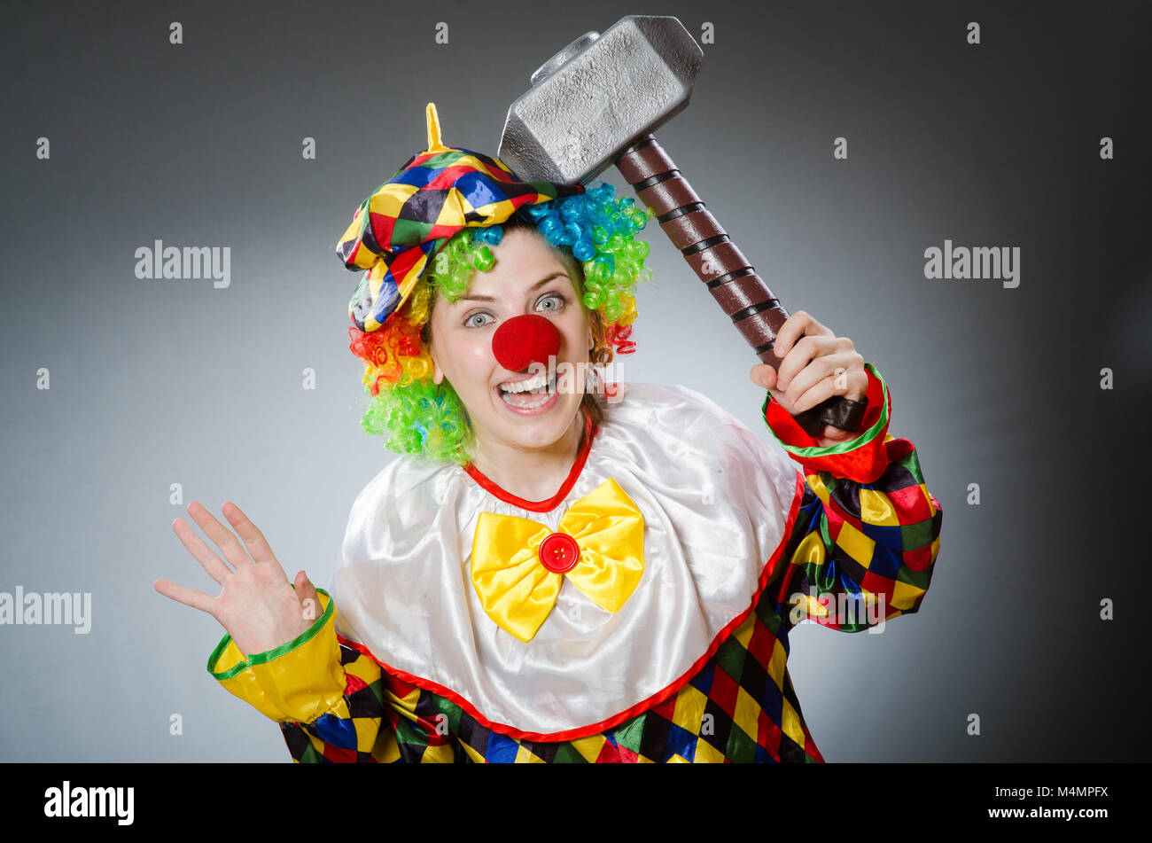 Woman waving hammer in hi-res stock photography and images - Alamy