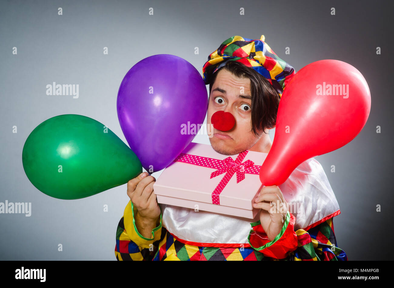 Funny clown in comical concept Stock Photo - Alamy