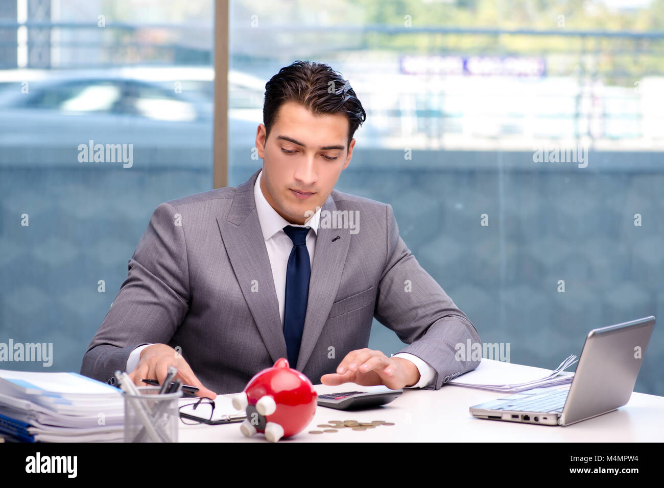 Bankrupt broke businessman with piggy bank Stock Photo - Alamy