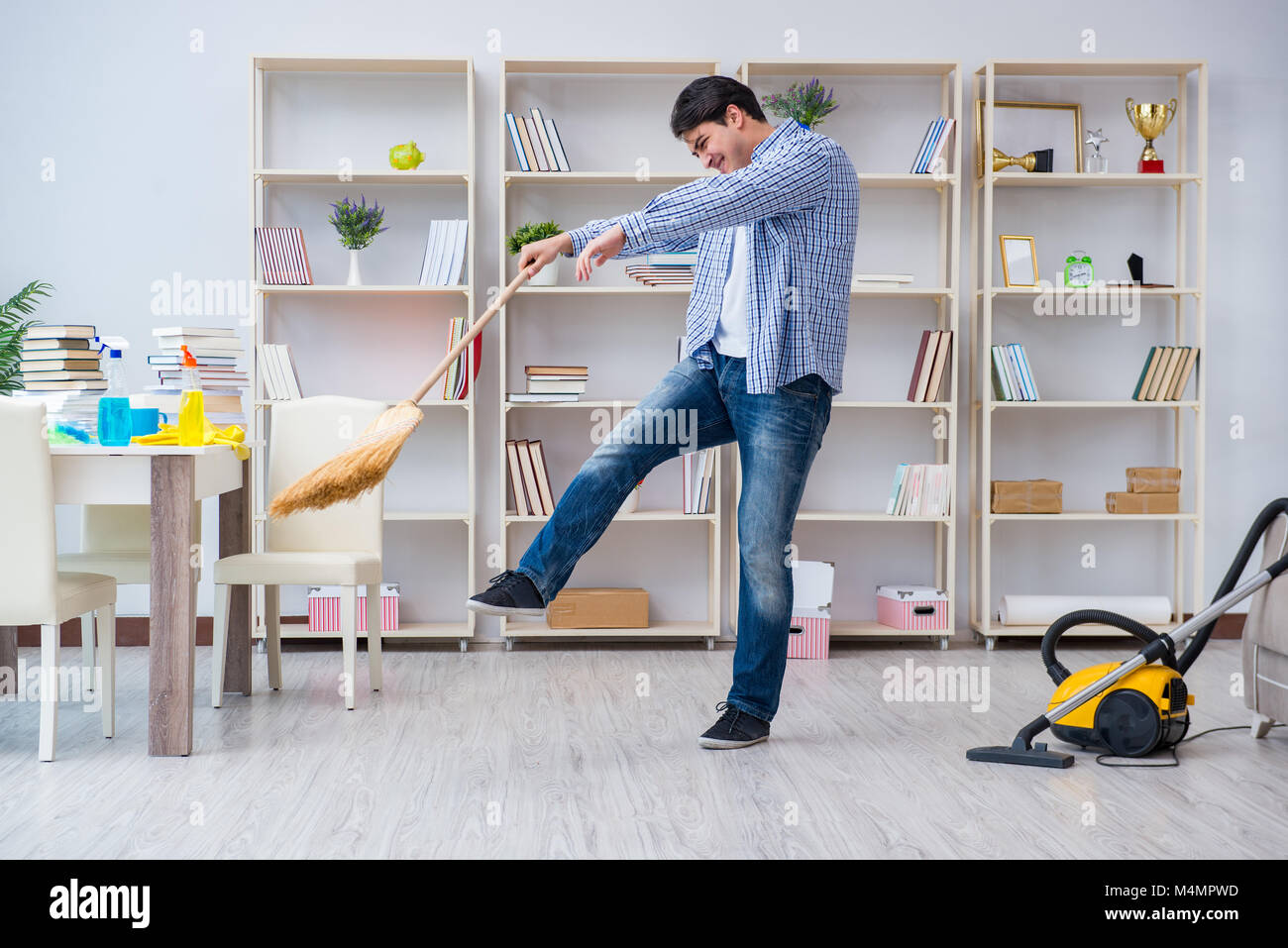 Man doing cleaning at home Stock Photo - Alamy