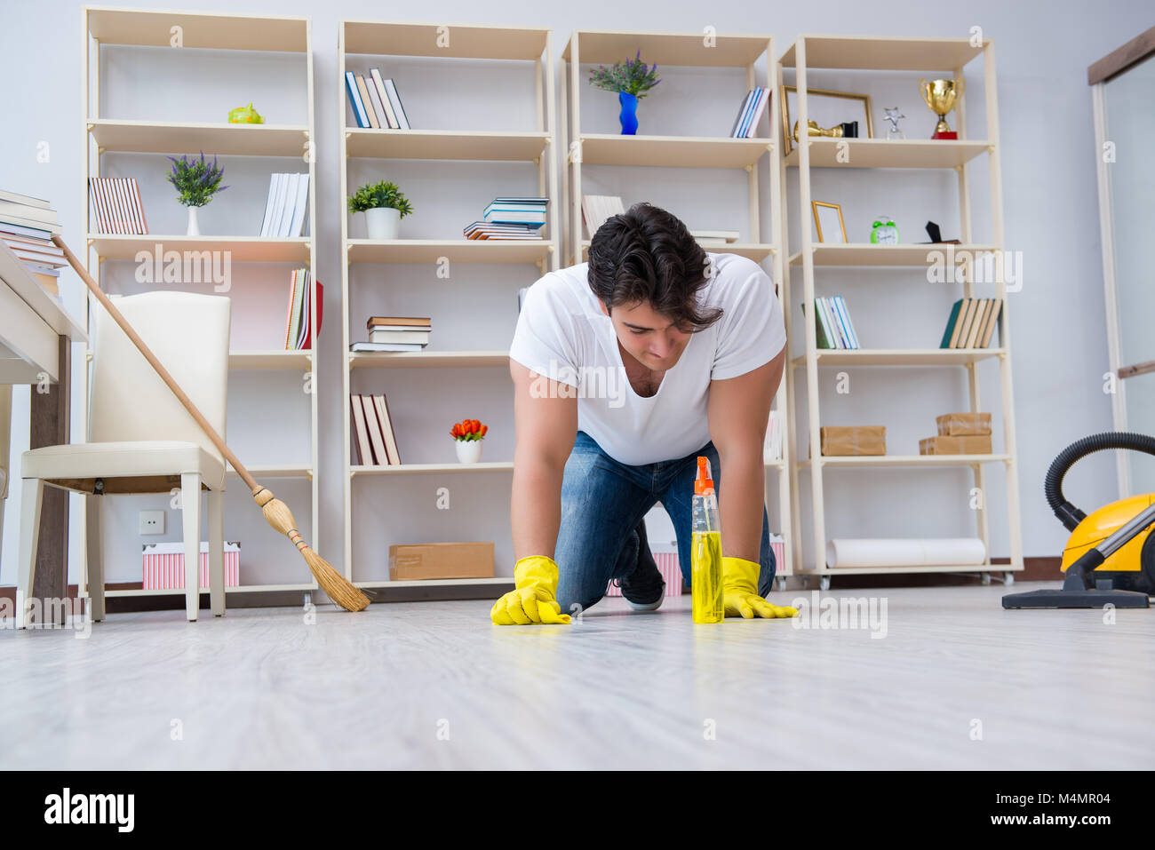 Man doing cleaning at home Stock Photo - Alamy