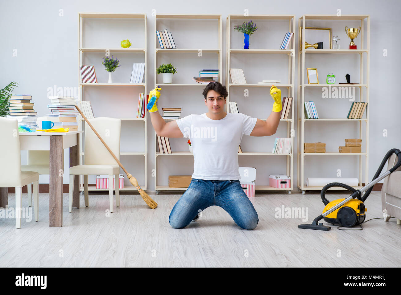 Man doing cleaning at home Stock Photo - Alamy